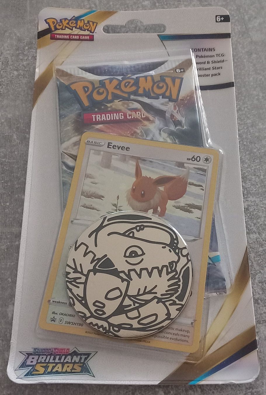 Pokemon Strahlende Sterne Evoli Blister mit Münze (englisch) (Neu und ...
