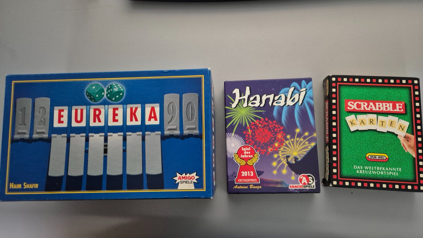 EUREKA, SCRABBLE und Hanabi 3 Kartenspiele zu verkaufen. (Neu (gemäss ...
