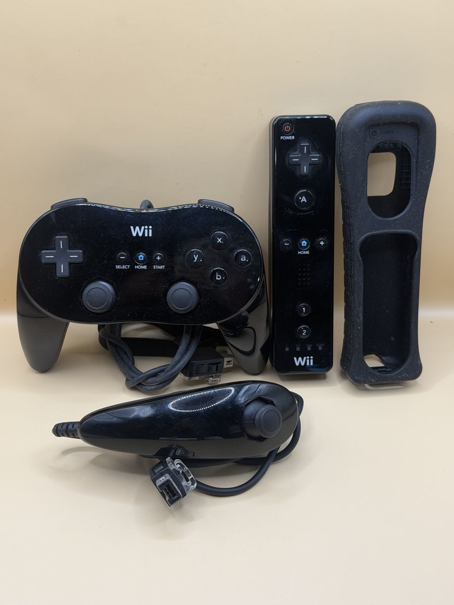 Lot accessoires Wii officiels – Wiimote Nunchuk Black (D'occasion) à ...