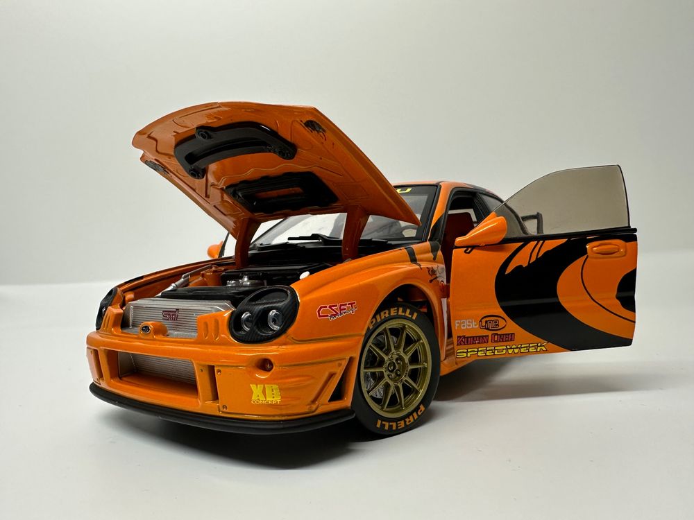 Subaru Impreza WRX STi 1:18, orange/schwarz, Bugeye,Solido, (Gebraucht) in Strengelbach für CHF ...