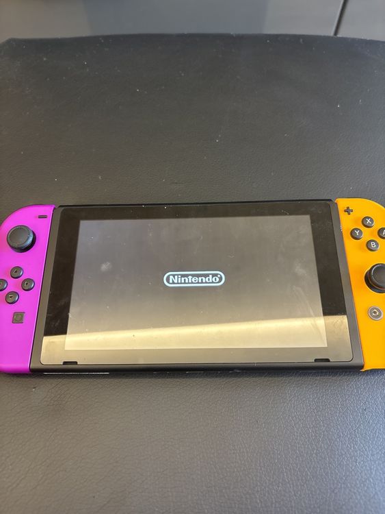 Nintendo Switch Neon-Lila/Orange, guter Zustand | Kaufen auf Ricardo