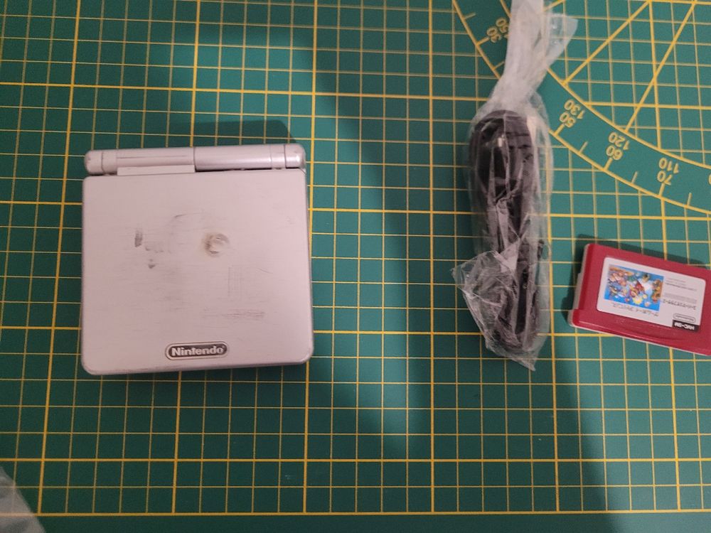 Gameboy advance SP silver + Super mario bros | Acheter sur Ricardo