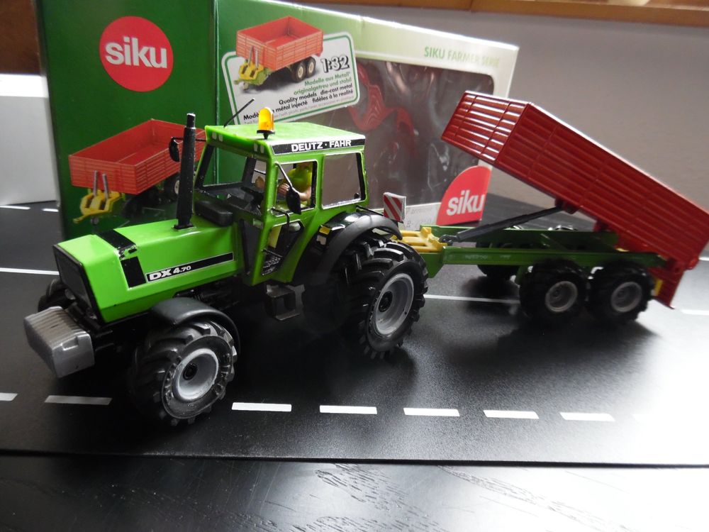 Siku Traktor Deutz DX 4.70 mit Tandem Anhänger | Kaufen auf Ricardo