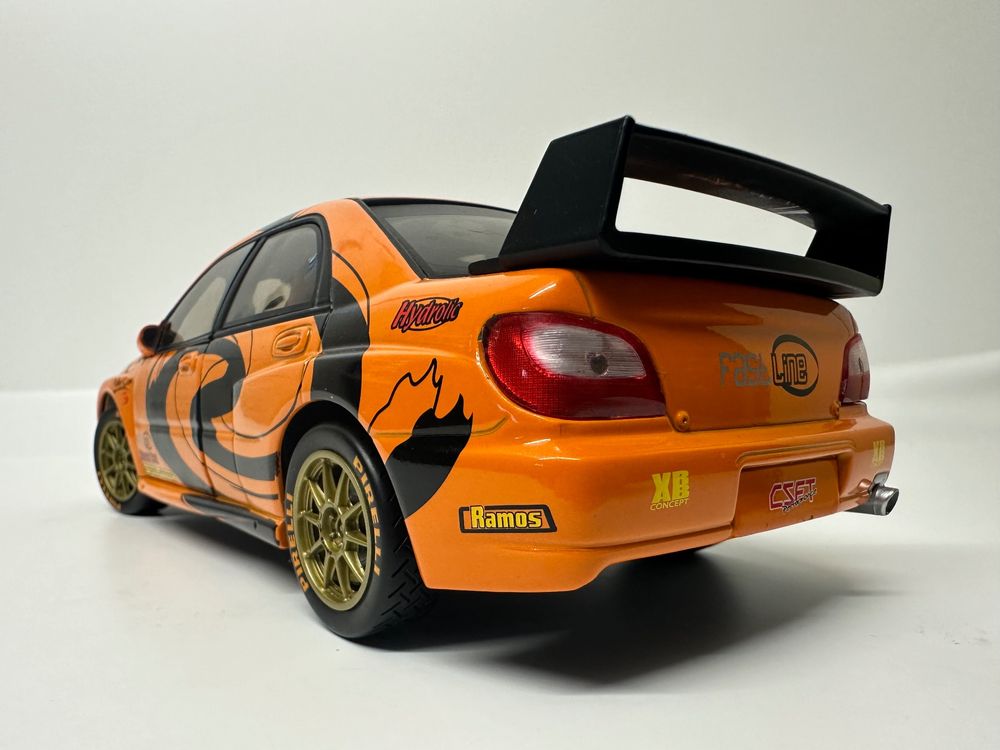 Subaru Impreza WRX STi 1:18, orange/schwarz, Bugeye,Solido, (Gebraucht) in Strengelbach für CHF ...