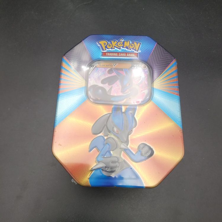 Pokémon Lucario Tin (Neu und originalverpackt) in Domat/Ems für CHF 39. ...