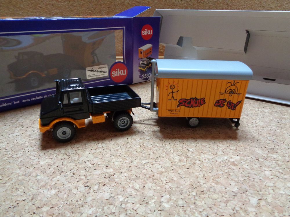 SIKU 2533 Unimog U 1500 mit Bauwagen | Acheter sur Ricardo