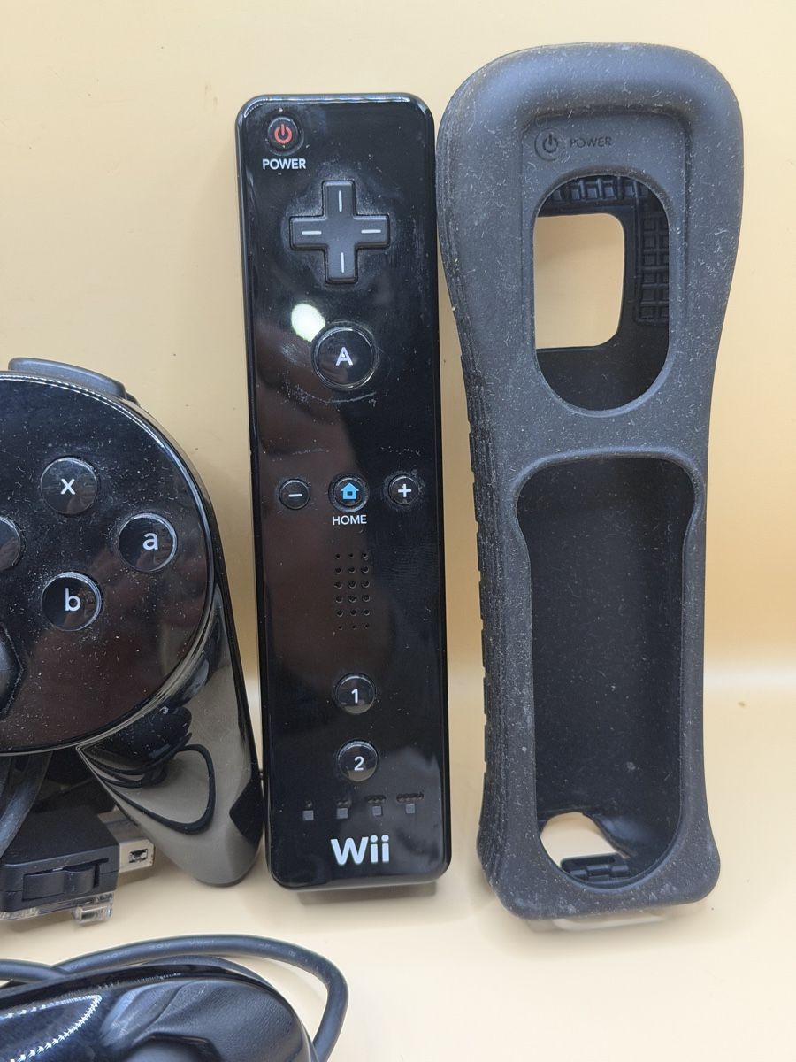 Lot accessoires Wii officiels – Wiimote Nunchuk Black (D'occasion) à ...