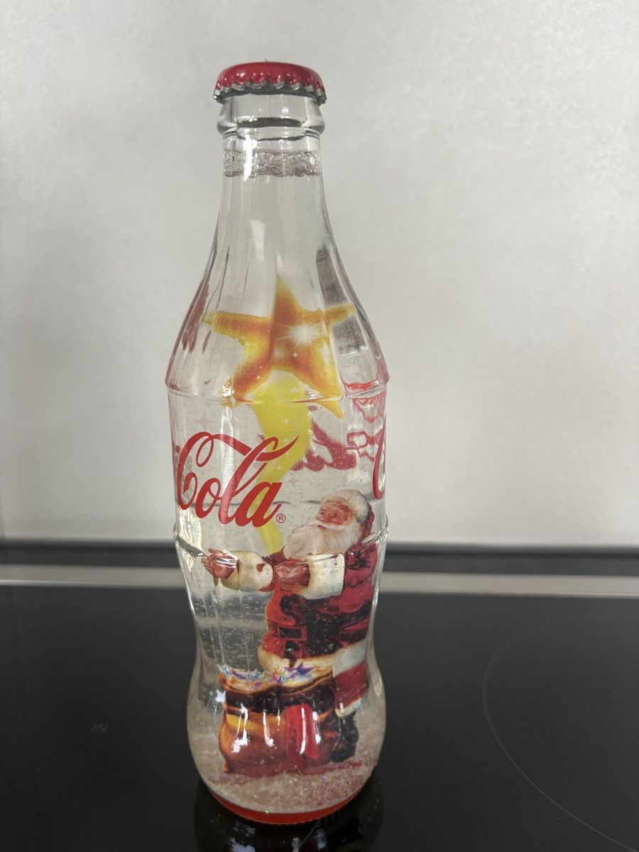 Glass bottle from Coca-Cola with Santa Claus and snowflakes (Neu ...