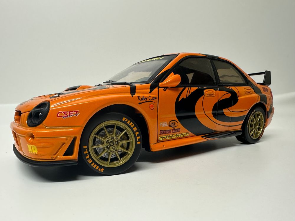 Subaru Impreza WRX STi 1:18, orange/schwarz, Bugeye,Solido, (Gebraucht) in Strengelbach für CHF ...