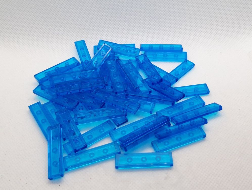 Lego 50 Stk. Flat Tile 1x4 trans. blue (Gebraucht) in Inwil für CHF 5 ...