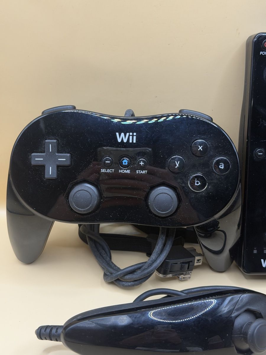 Lot accessoires Wii officiels – Wiimote Nunchuk Black (D'occasion) à ...