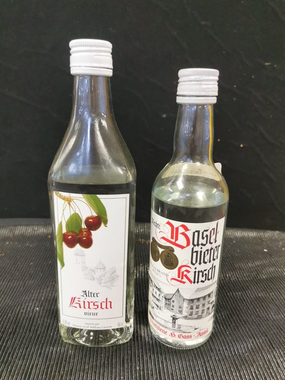 Lot de 2 KIRSCH ANCIENS BOUTEILLES ENTAMÉES (Gebraucht) in Genève für CHF 19 – mit Lieferung auf ...