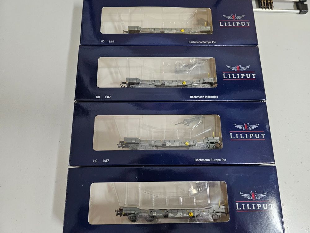 Liliput L225704 X 4 wagons plat transport lourd dès1.-fr (Gebraucht) in bassecourt für CHF 73 ...