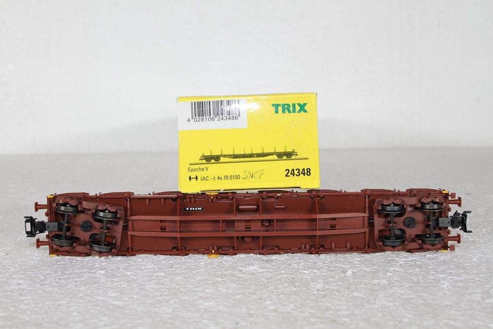 Trix 24348 SNCF Flachwagen mit Rungen mit AC Achsen (Neu (gemäss ...