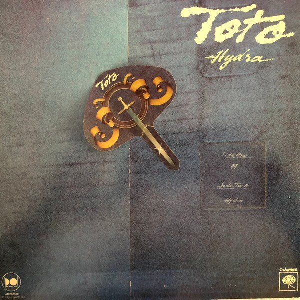 Toto, Hydra: 99 - Shape Picture Disc USA | Kaufen auf Ricardo