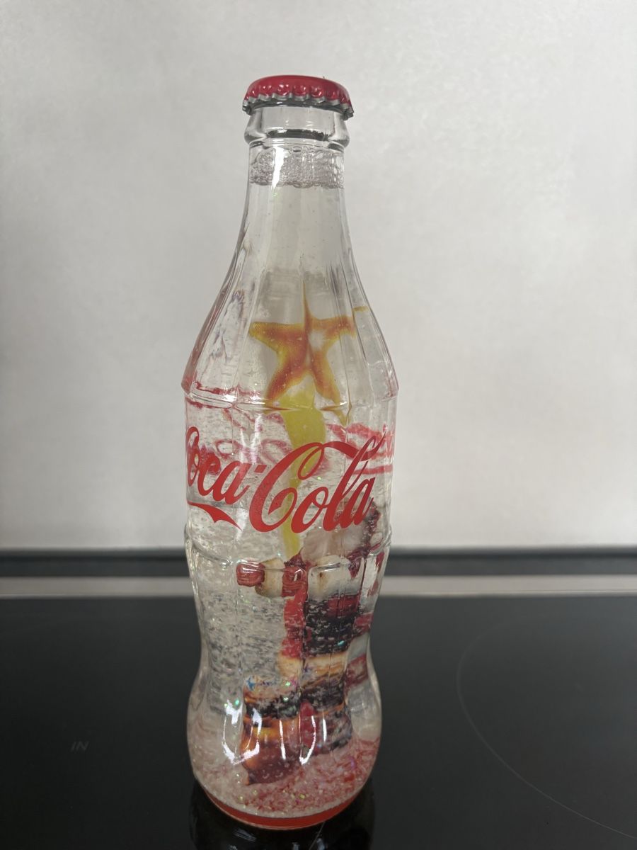 Glass bottle from Coca-Cola with Santa Claus and snowflakes (Neu ...