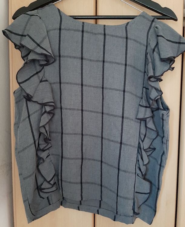 LittleMiss Blouse gris/noir avec des volants | Kaufen auf Ricardo