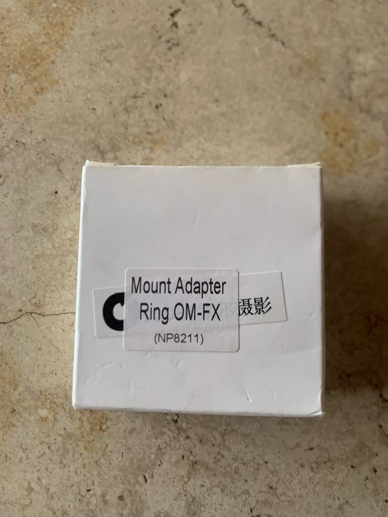 Adaptateur monture objectif OM-FX NPB211 (Neu und originalverpackt) in Develier für CHF 10 – mit ...