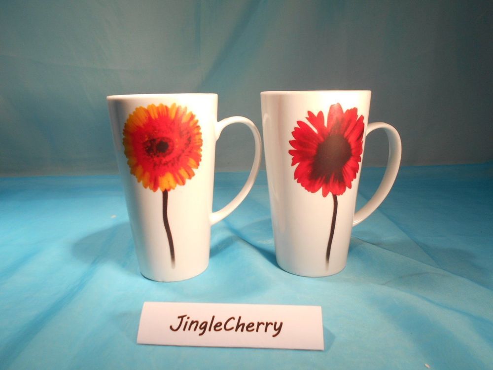2 Tassen mit roter und oranger Gerbera (Gebraucht) in Bellach für CHF 2 ...