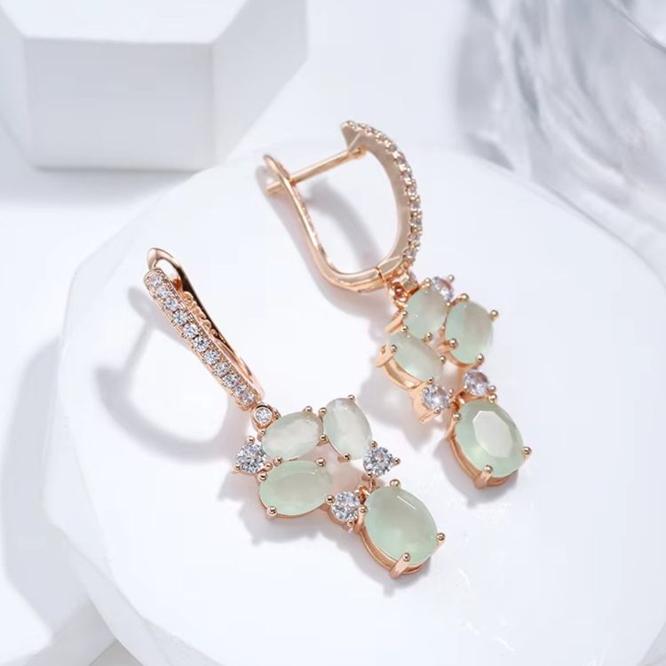 Boucles - plaqué or rose - stamp 585 - zircons vert pale (Neuf avec ...