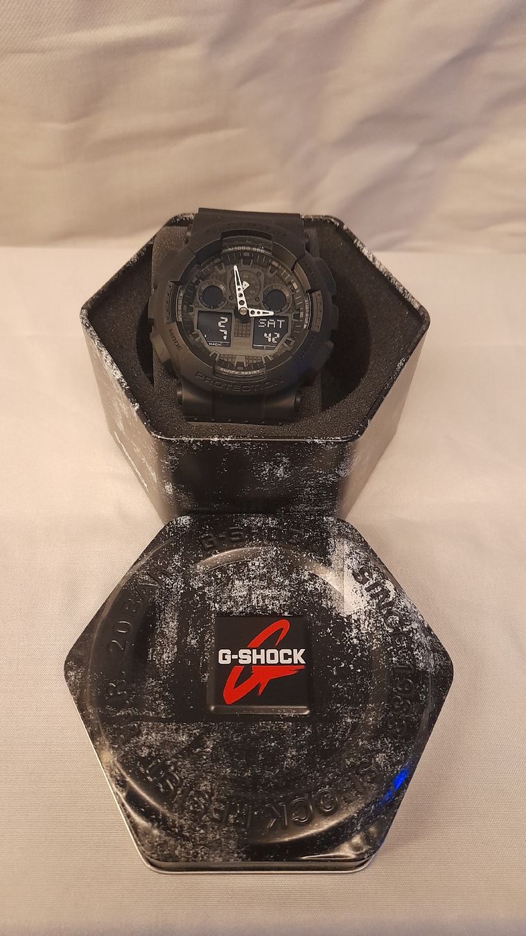 G-Shock GA-100-1A1ER, neuve, jamais portée, noire (Neuf avec emballage ...