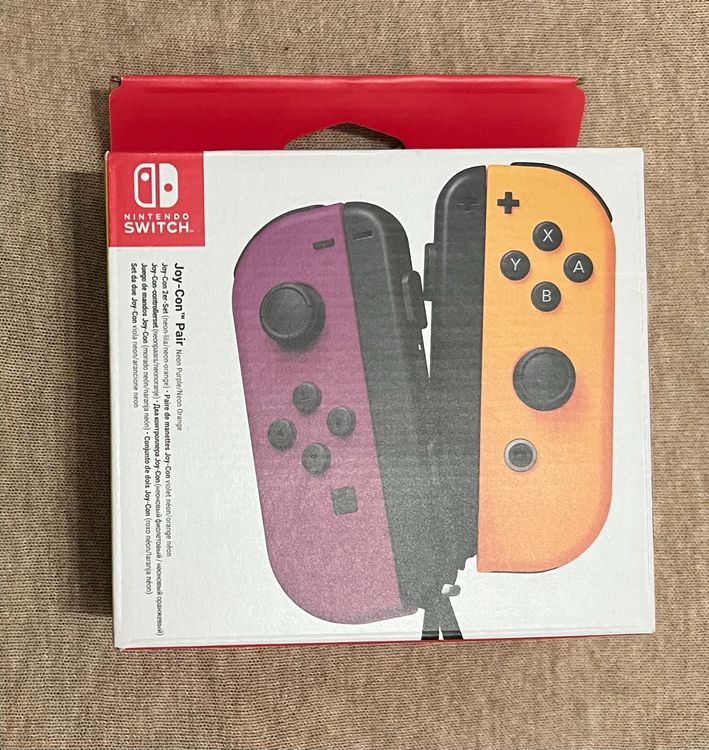 Nintendo Switch Joy-Cons Neon Purple/Neon Orange | Kaufen auf Ricardo