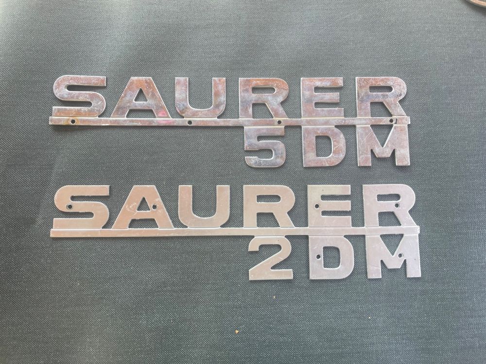 Originale Saurer Embleme 5 DM / 2 DM (Gebraucht) in Lienz für CHF 81 ...